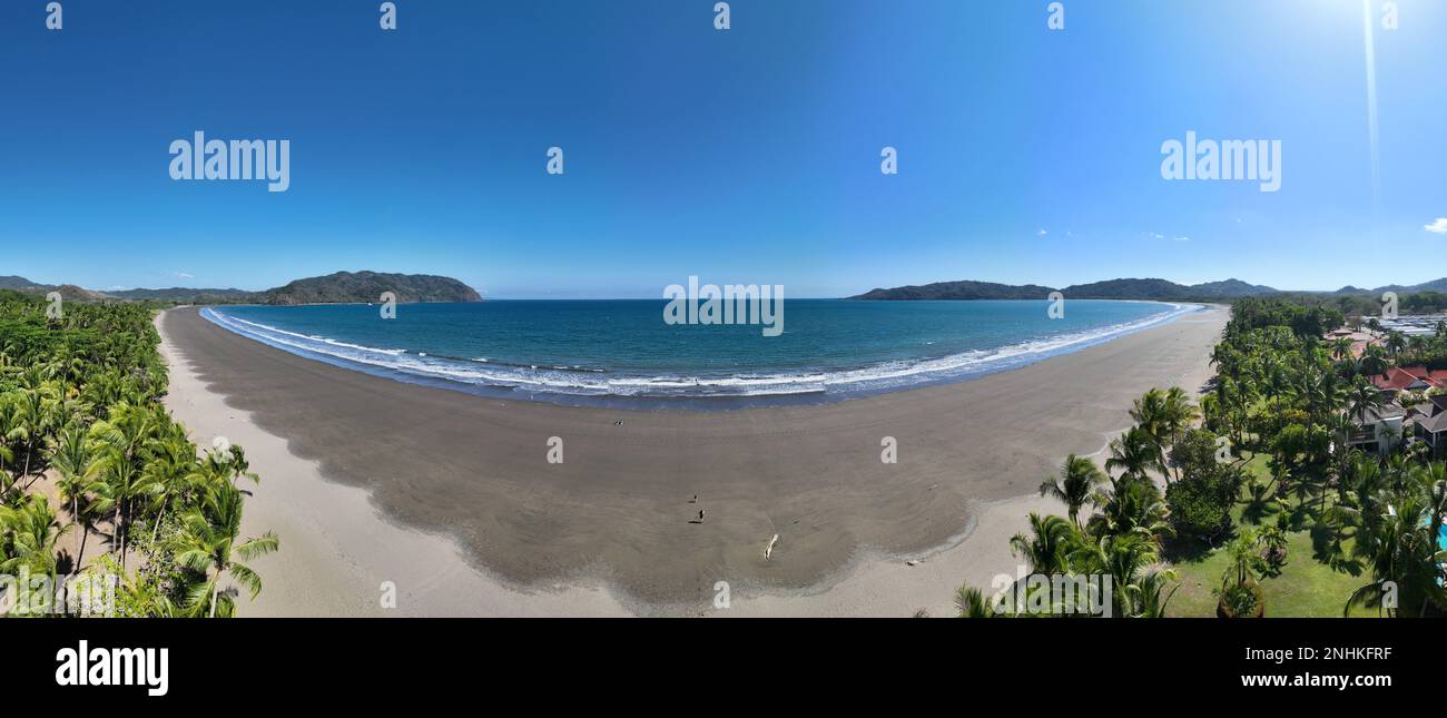 Lush Tropical coastline with rocks and blue water in Costa Rica near ...