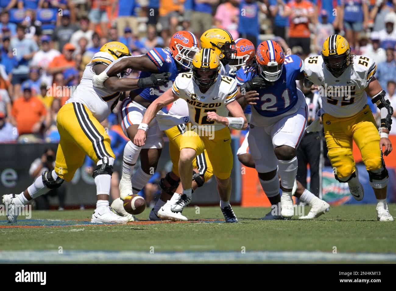 Missouri quarterback Brady Cook (12) chases down his fumble during the ...
