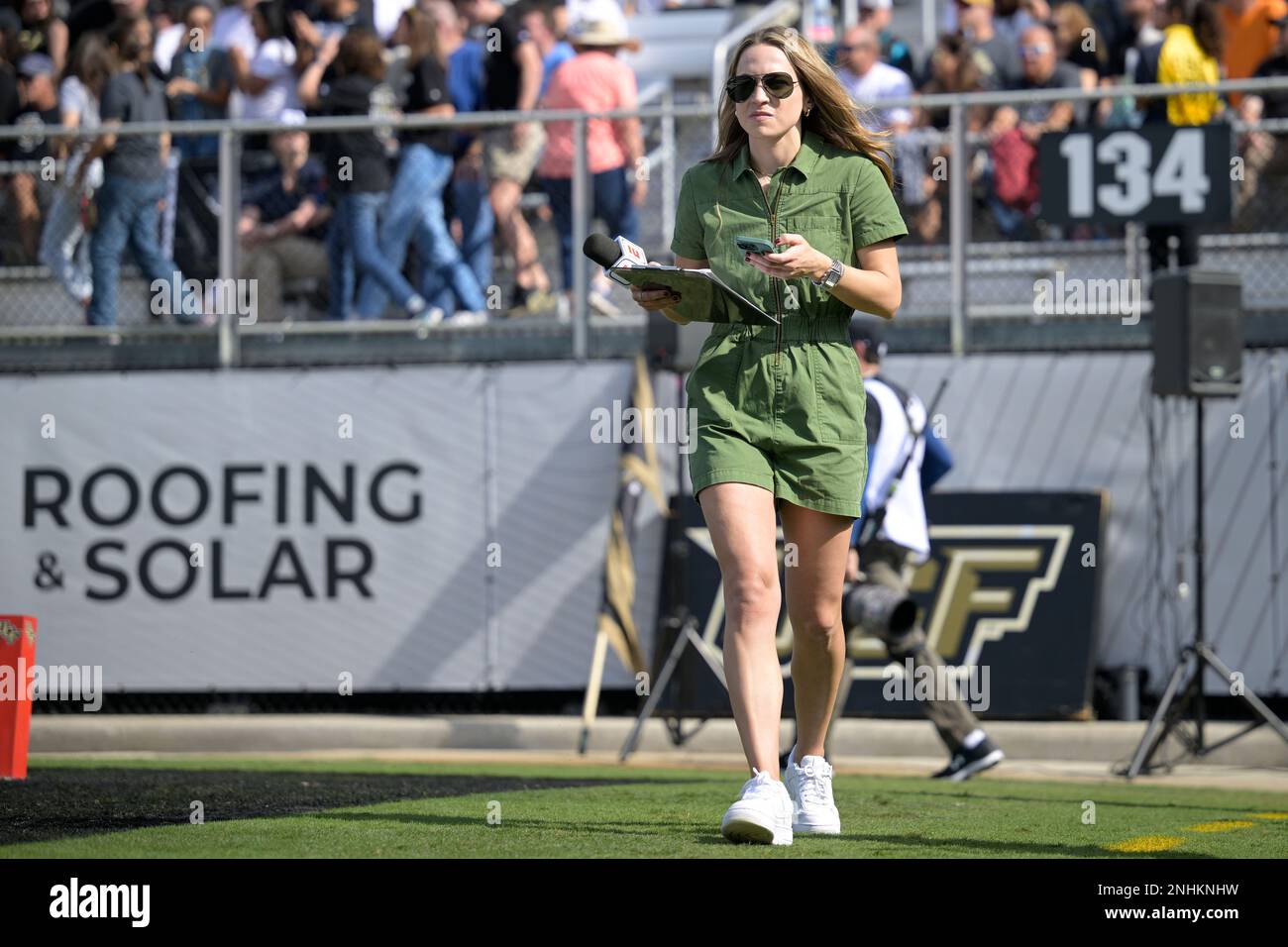 ESPN sideline reporter Dana Boyle walks behind the end zone during the ...