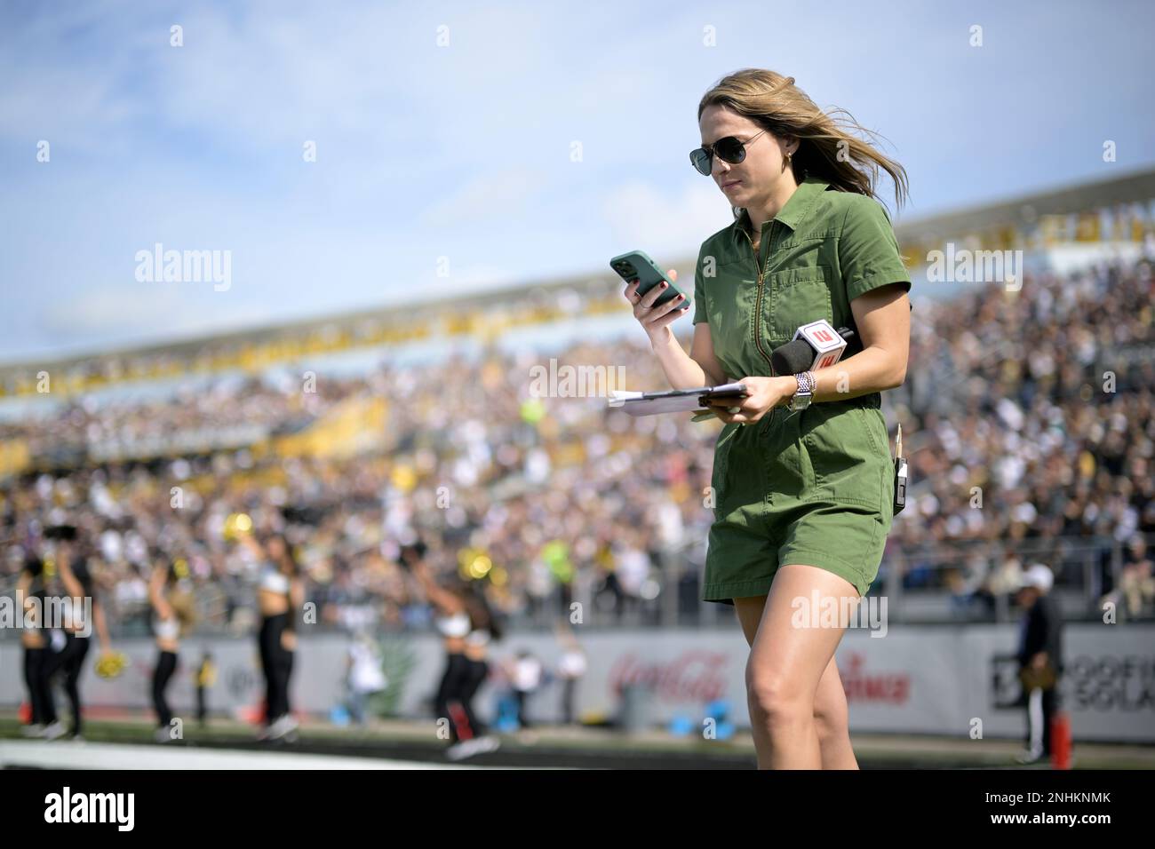 ESPN sideline reporter Dana Boyle walks behind the end zone during the ...