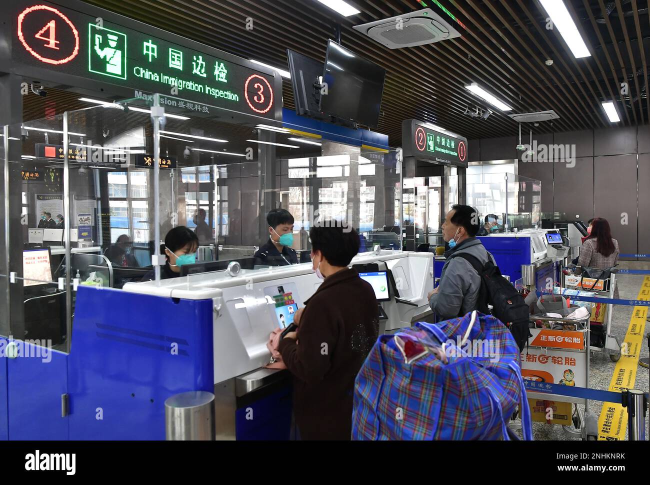 **CHINESE MAINLAND, HONG KONG, MACAU AND TAIWAN OUT** Passengers wait ...