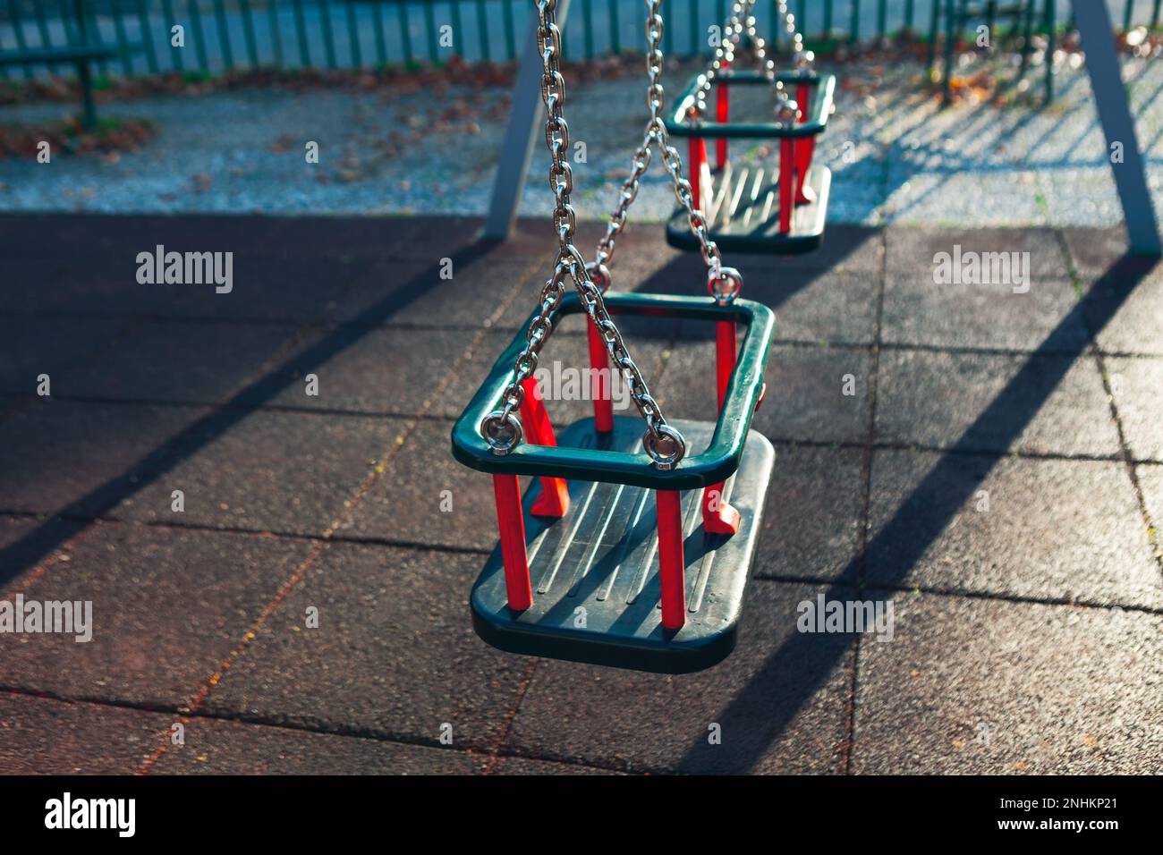 Swing in playground . Swing with silver chains Stock Photo - Alamy