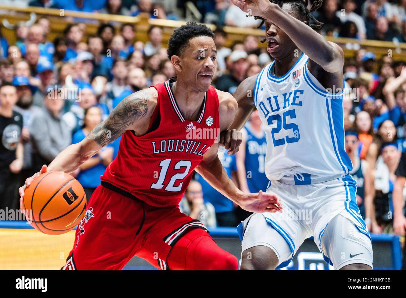 Duke forward Mark Mitchell (25) guards Louisville forward JJ Traynor ...