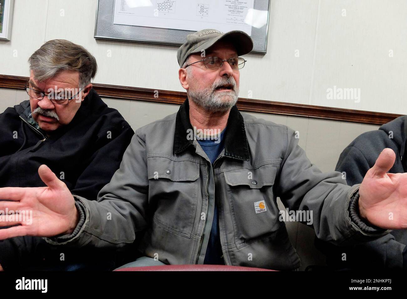 Tony Perna ,hands in air, asks a question about the process of the ...