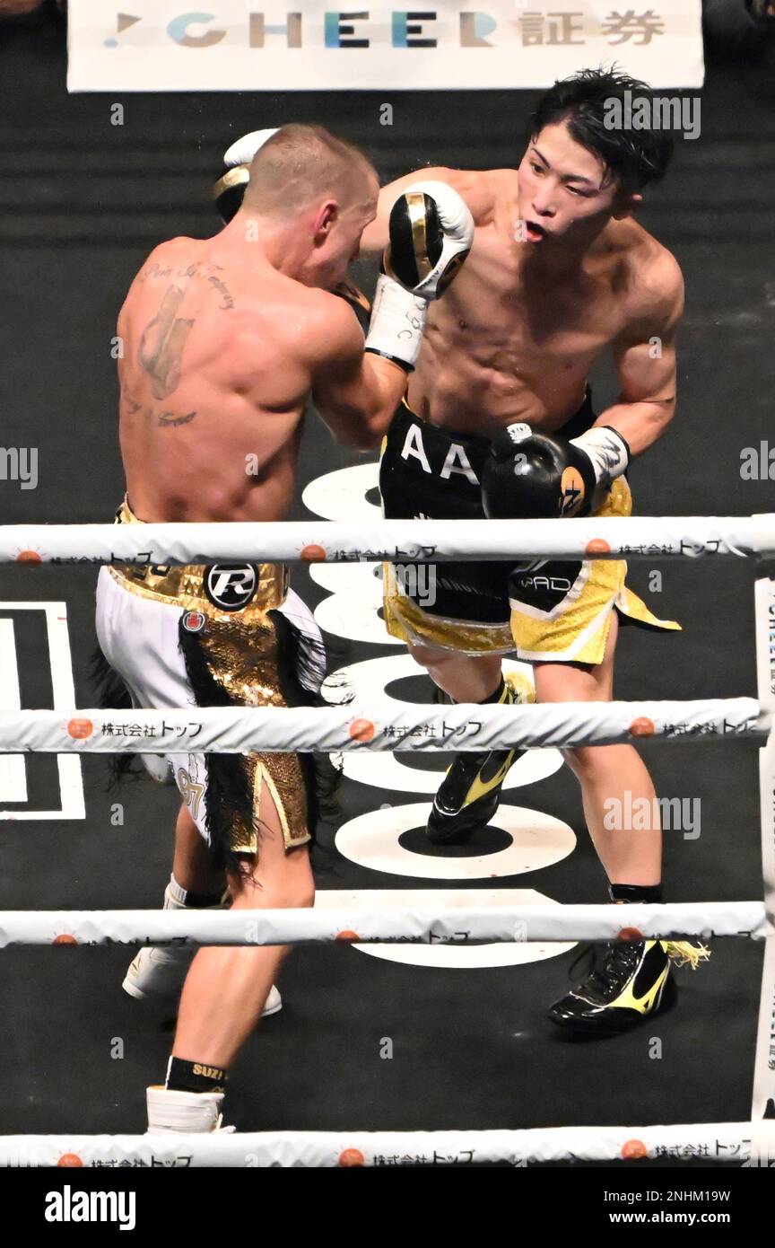 Naoya Inoue (R), Japanese three-division bantamweight champion, delivers his punch against ...