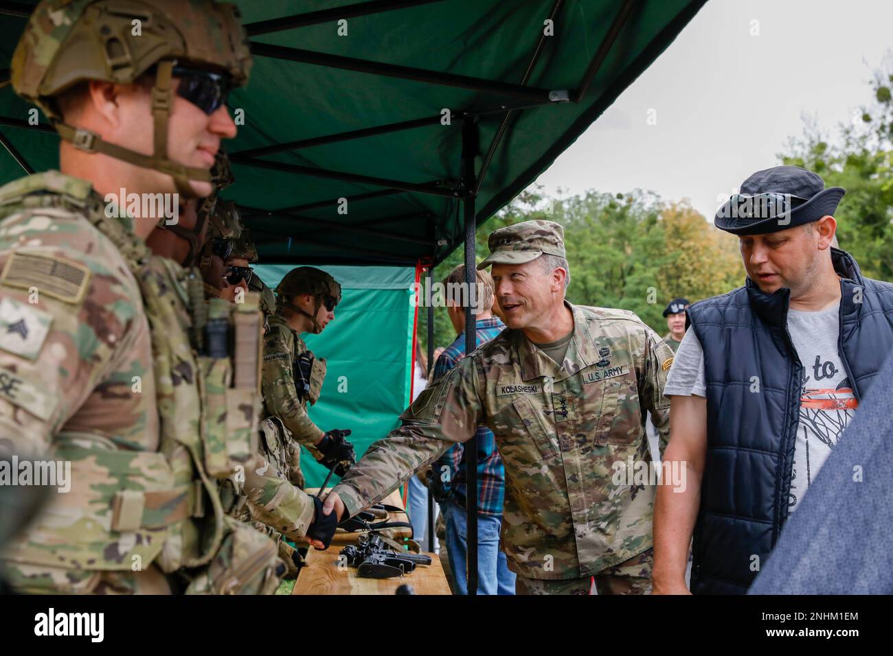 U.S. Army Lt. Gen. John Kolasheski, commander of V Corps, greets U.S. Soldiers assigned to ...