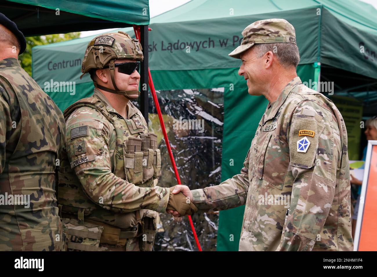 U.S. Army Lt. Gen. John Kolasheski, commander of V Corps, greets U.S. Army Staff Sgt. Marco ...