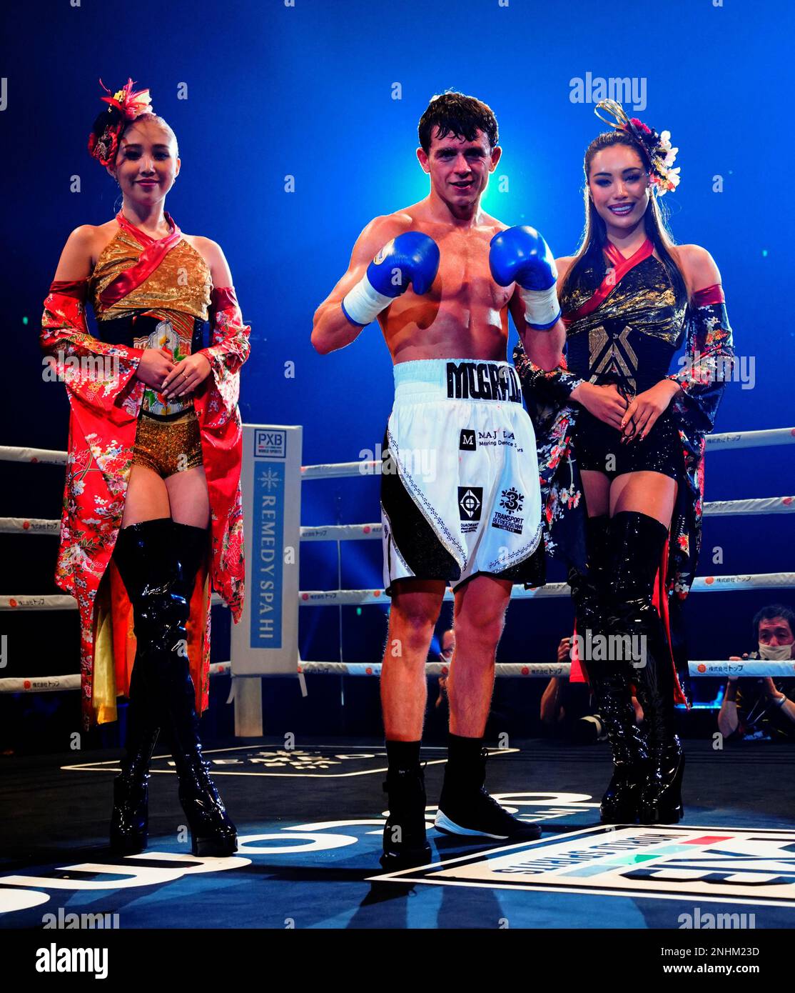 Peter McGrail (C) of the U.K. poses after winning Hironori Miyake of ...