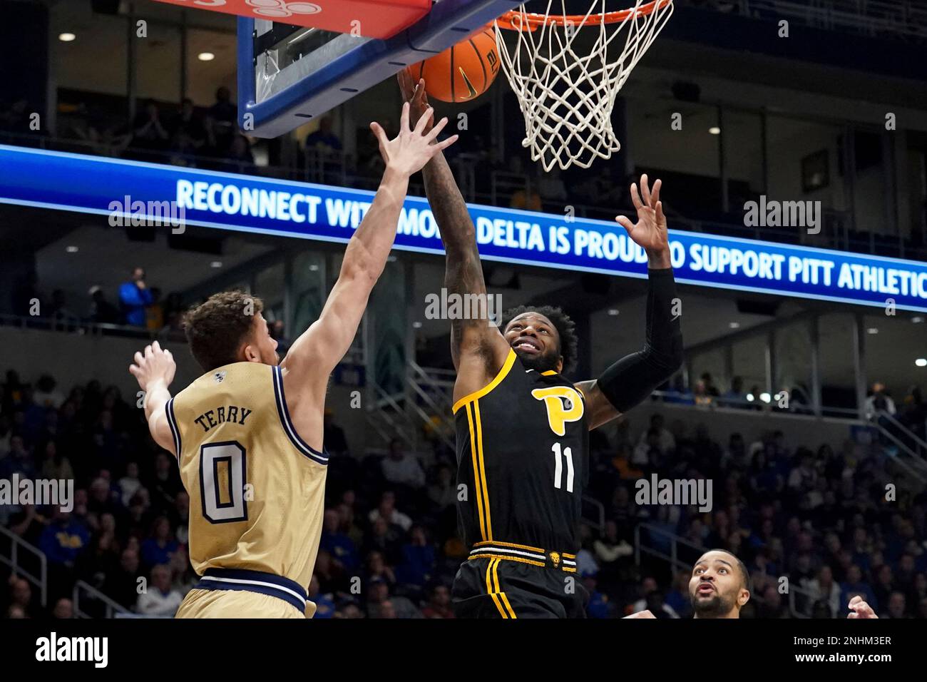 Pittsburgh guard Jamarius Burton (11) lays the ball up in front of ...