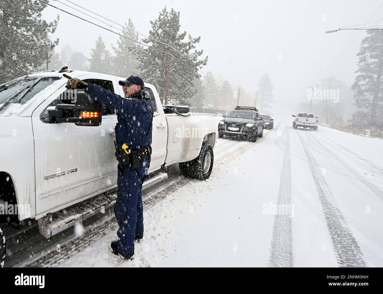 California Highway Patrol officer Mike Eshleman instructs a driver he ...