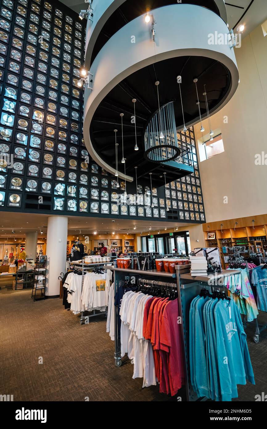 gold and silver records hanging on a wall at country music hall of fame ...