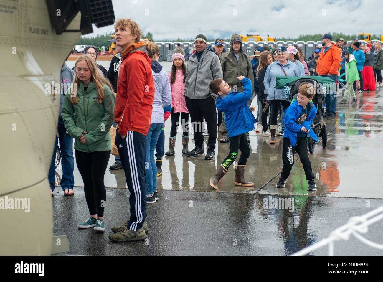The crowd waits in line to tour the inside of a CH-47 Chinook display ...