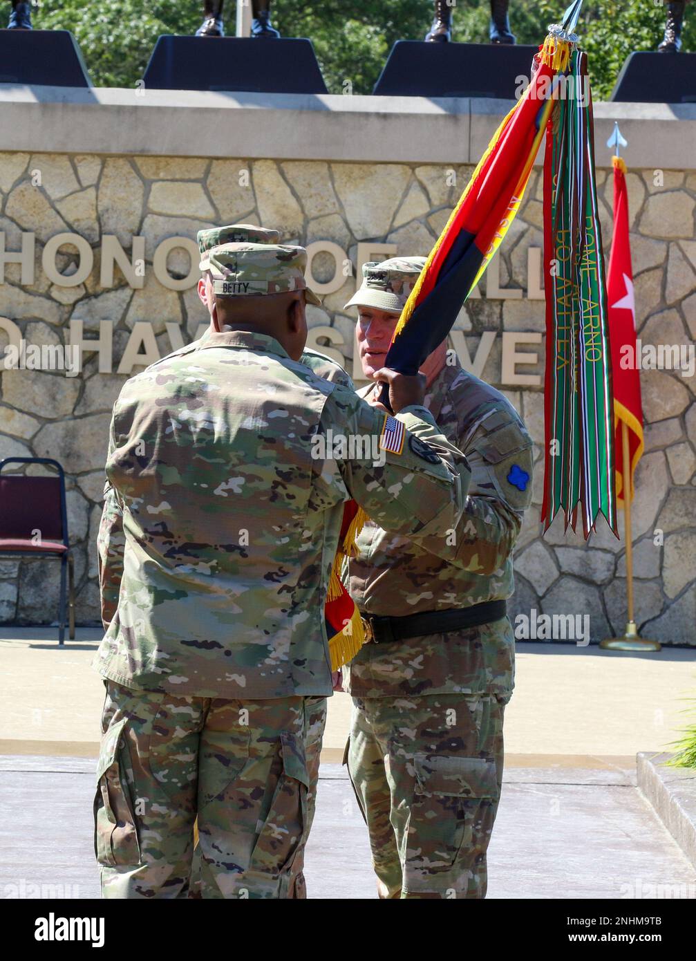 Major Gen. Matthew V. Baker, right, incoming commander, hands the unit ...