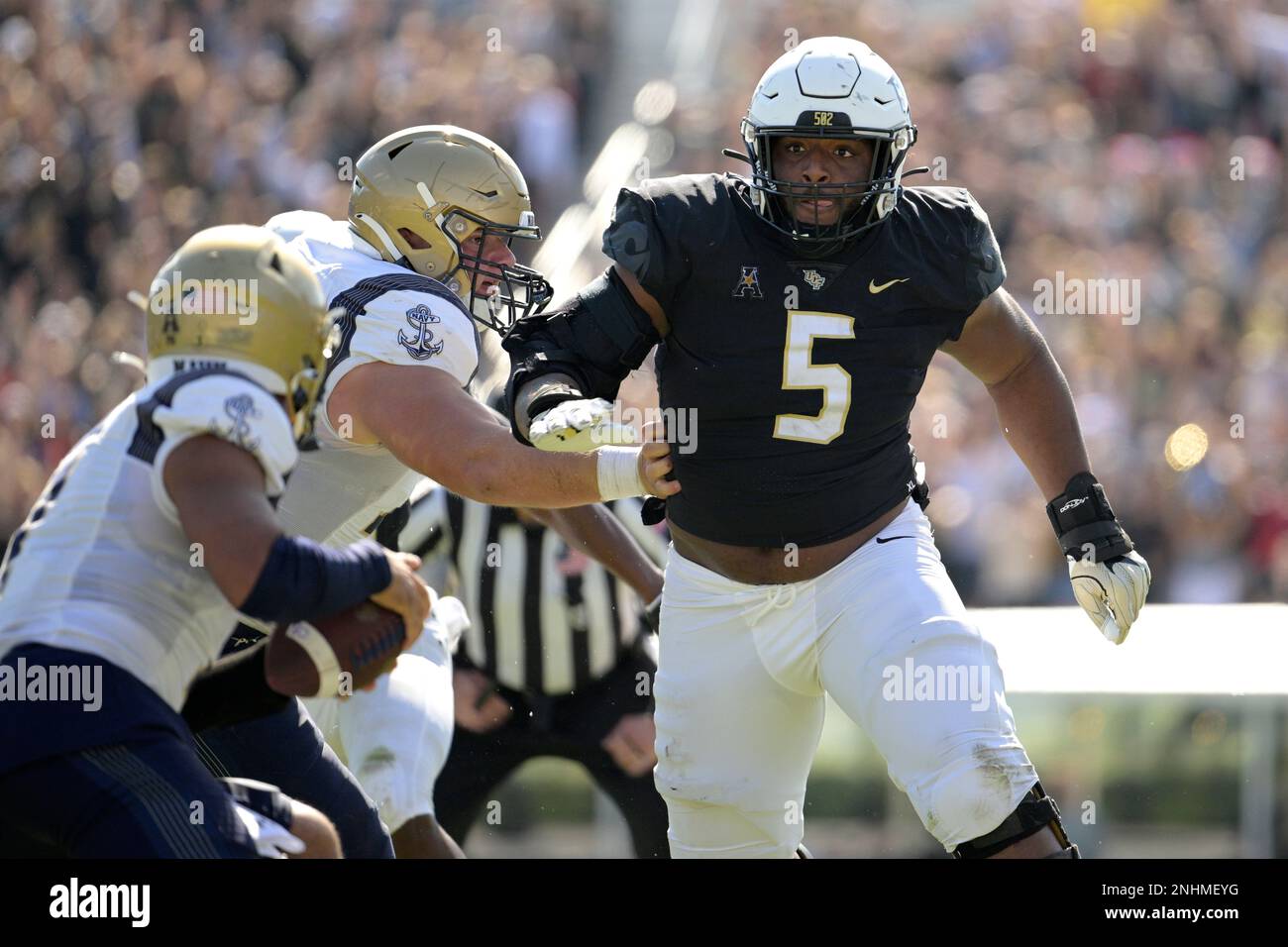 Central Florida defensive tackle Ricky Barber (5) pressures Navy ...