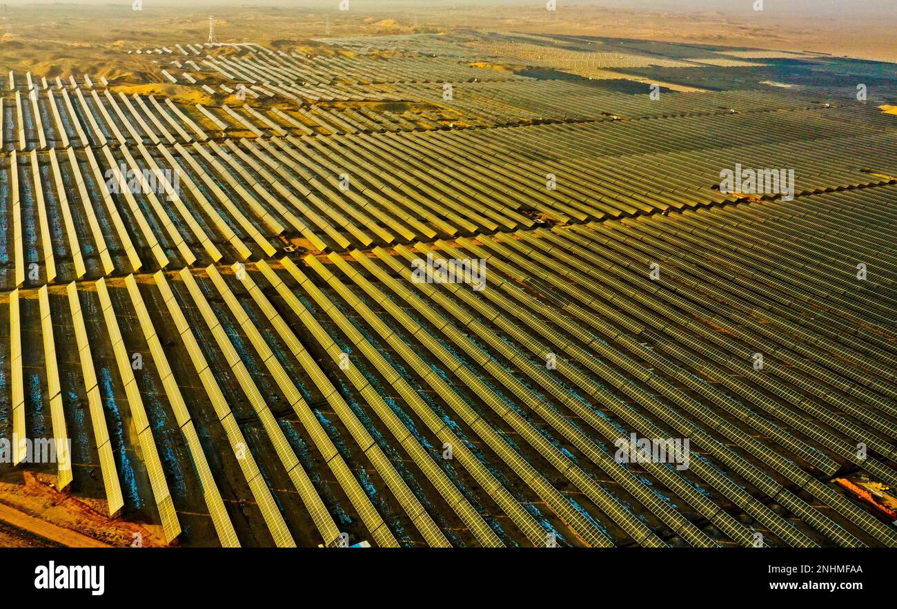 An aerial view of a solar power plant under construction in the desert ...