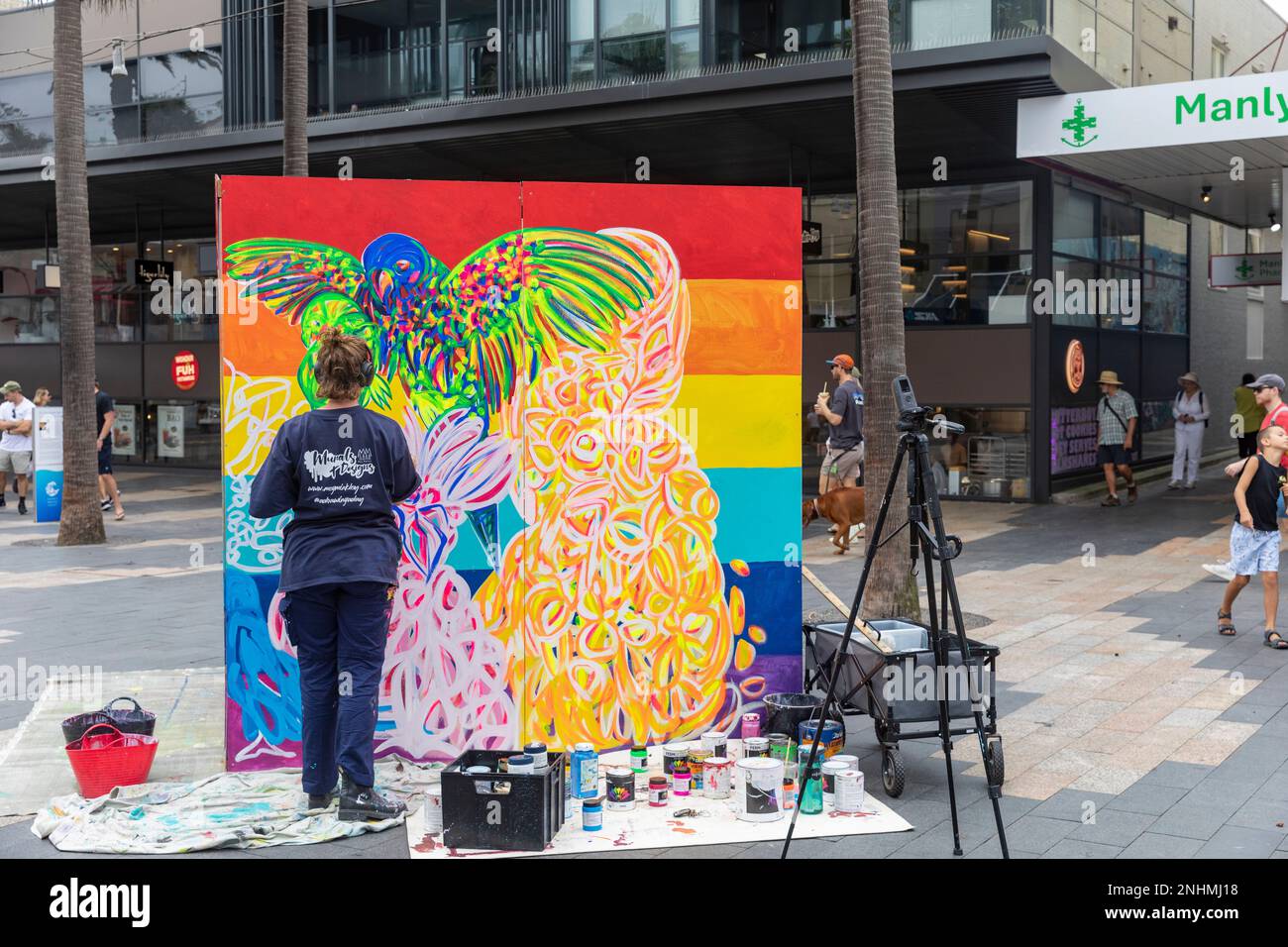 Australian female artist creating artwork on Manly beach corso to ...
