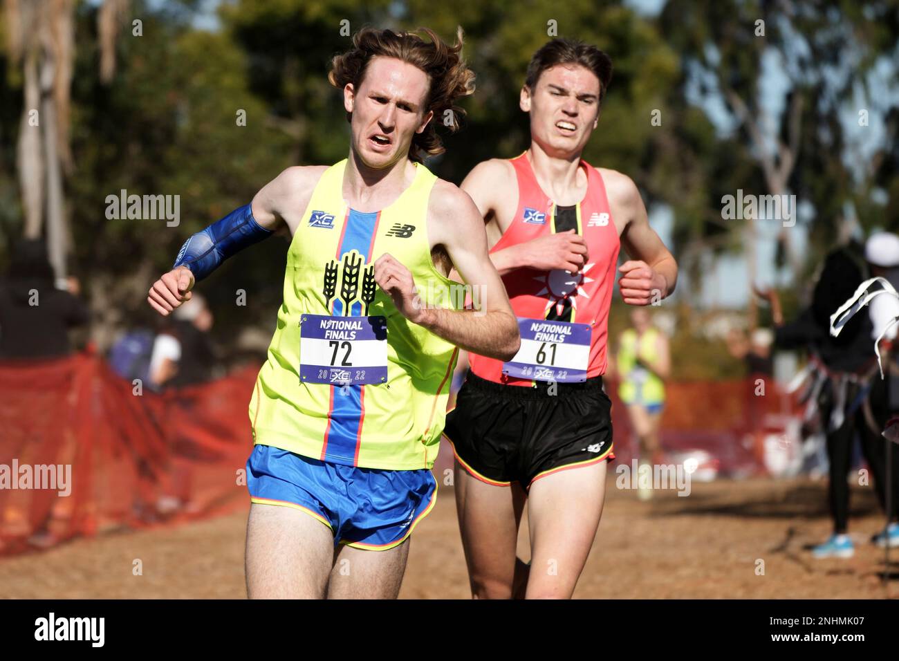 Kole Mathison (left) defeats Noah Breker to win the boys race in 14:46 ...