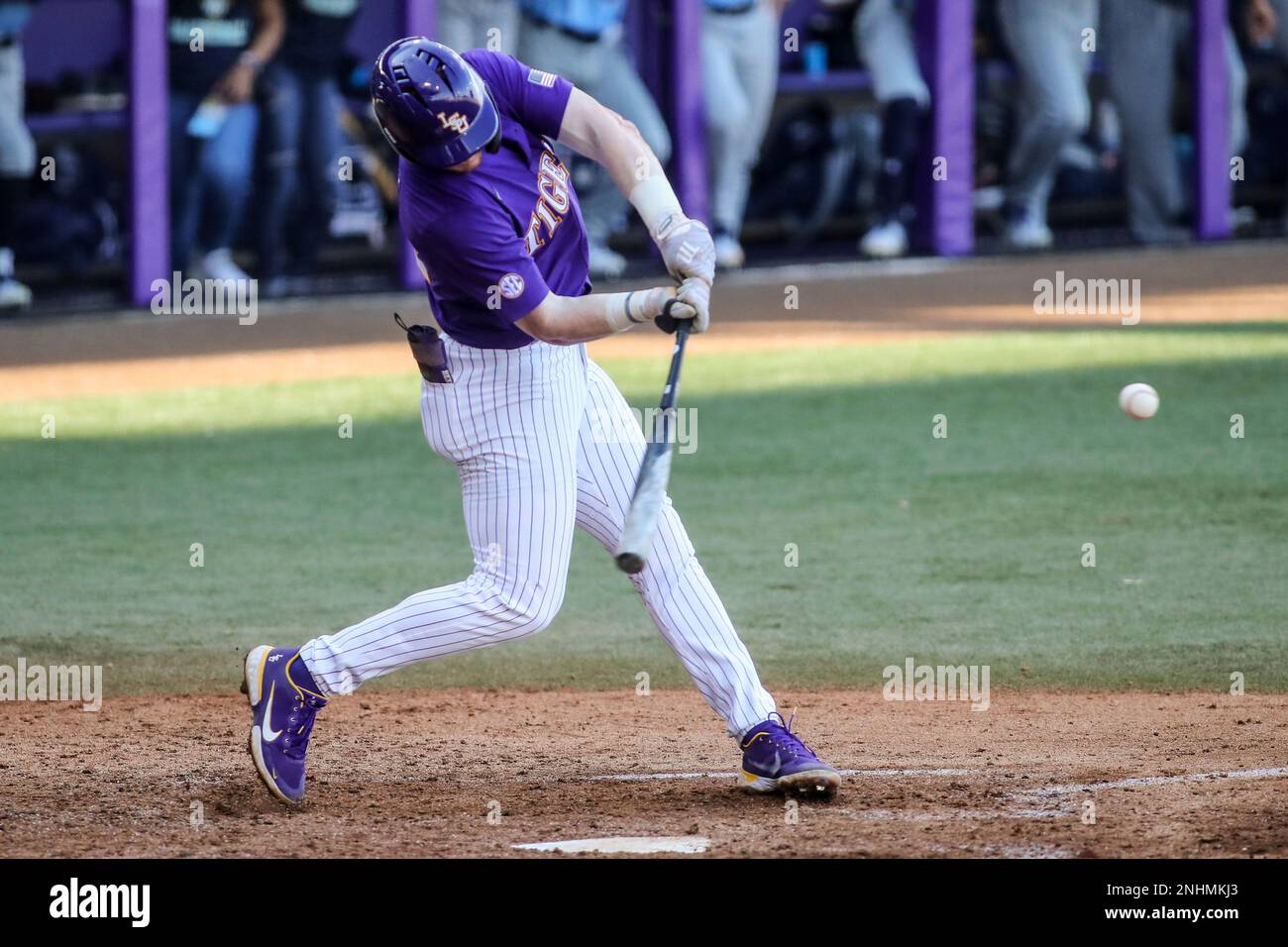 February 21, 2023: LSU's Jared Jones (22) connects for a home run during NCAA Baseball action ...