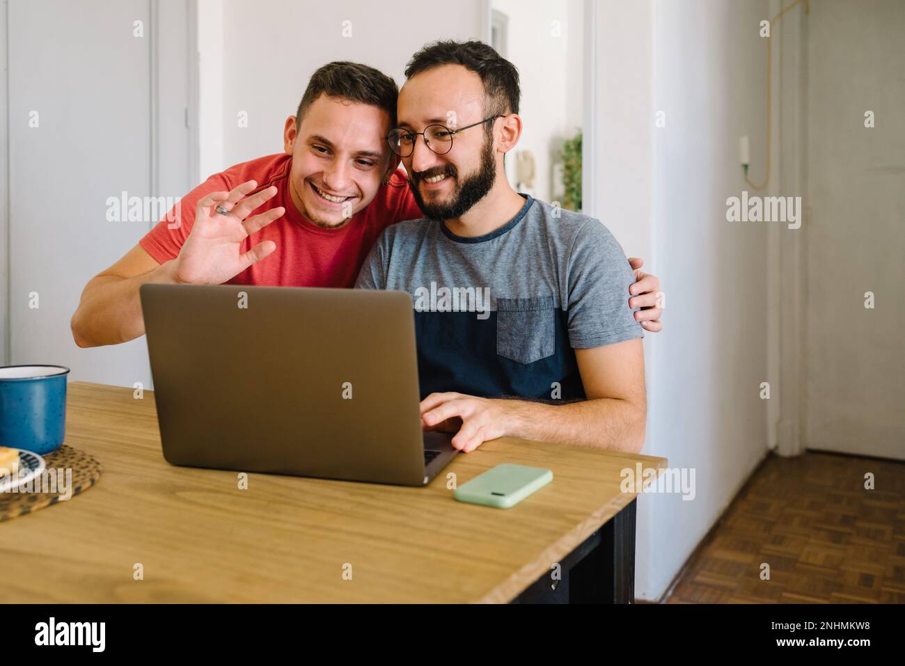 Two men laptop computer smiling hi-res stock photography and images - Alamy