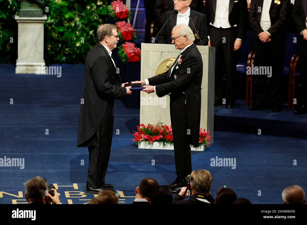 Alain Aspect receives the 2022 Nobel Prize in physics from King Carl Gustaf of Sweden during the ...