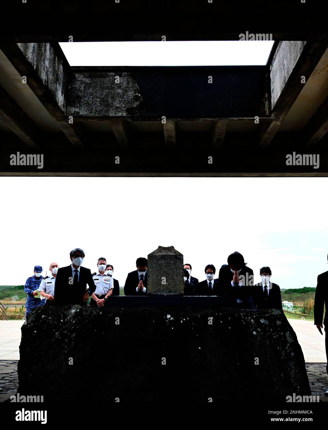 Japan-US military veterans and bereaved families visit the cave where Japanese soldiers fought ...