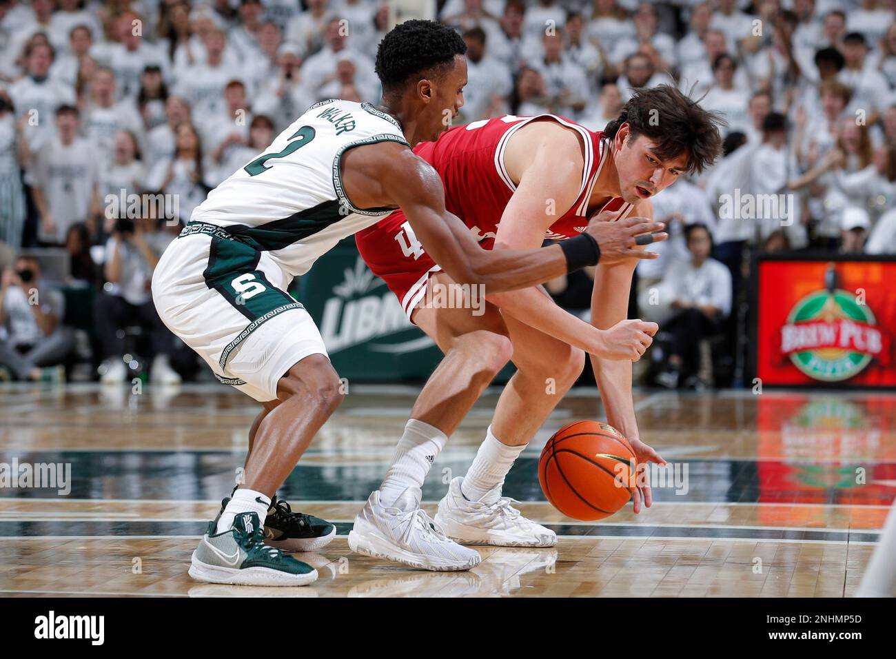 Michigan State's Tyson Walker, left, and Indiana's Trey Galloway vie ...