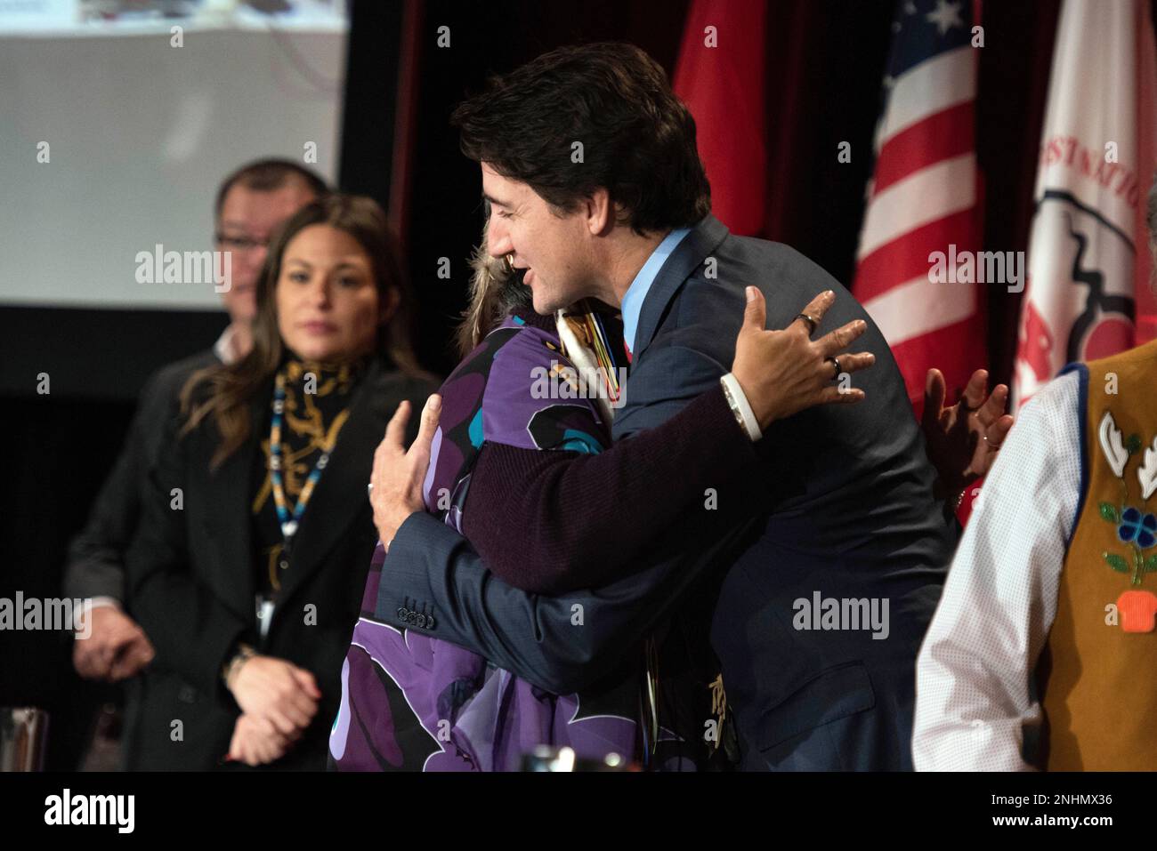 Prime Minister Justin Trudeau, right, receives a hug from Assembly of ...