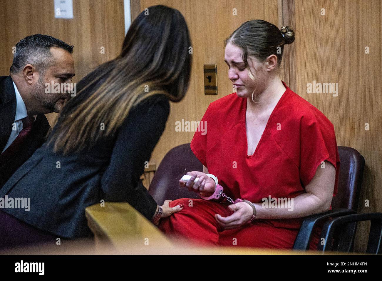 Defense attorneys Sabrina Puglisi and Frank Prieto talk to their client the OnlyFans model ...