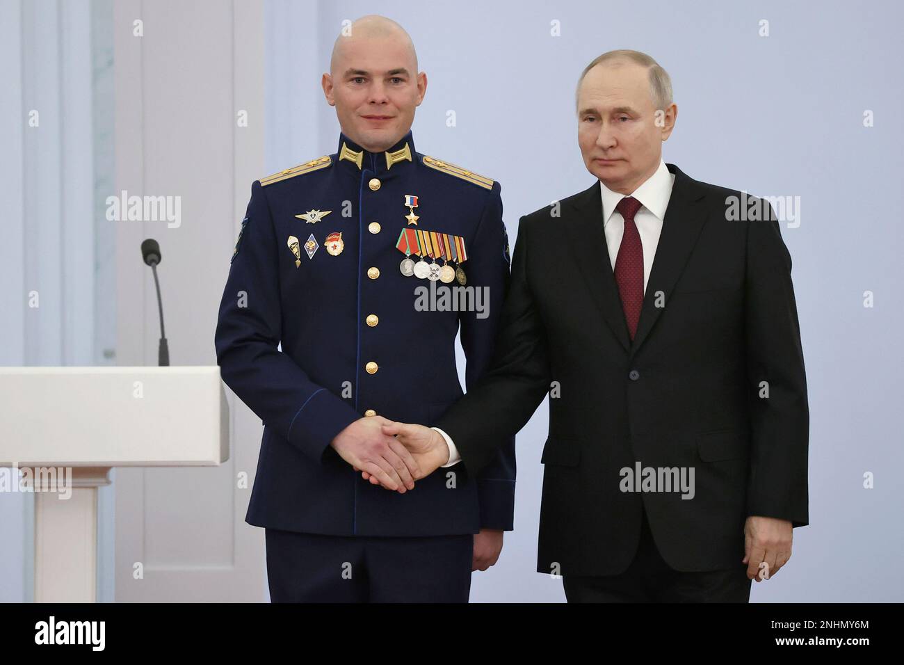 Russian President Vladimir Putin, right, shakes hands with Major Boris ...