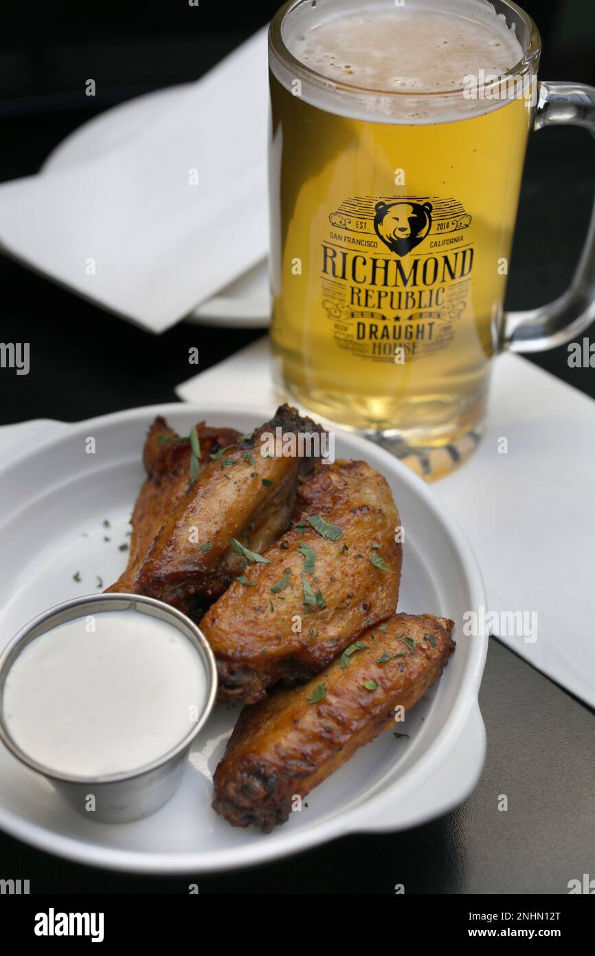 Fried chicken wings and Russian River STS pilsner served at Richmond ...