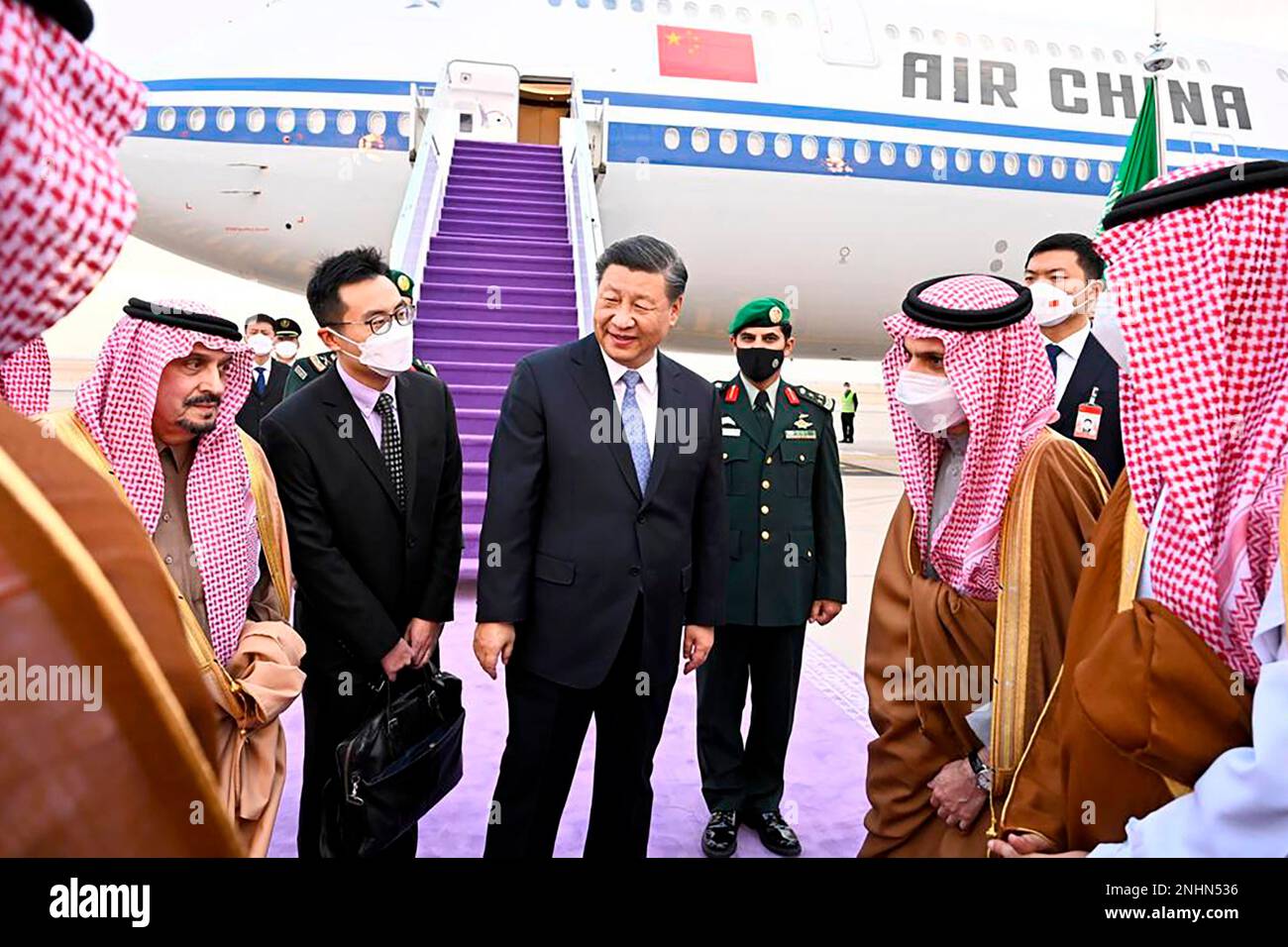 Chinese President Xi Jinping, center, greets by Prince Faisal bin ...