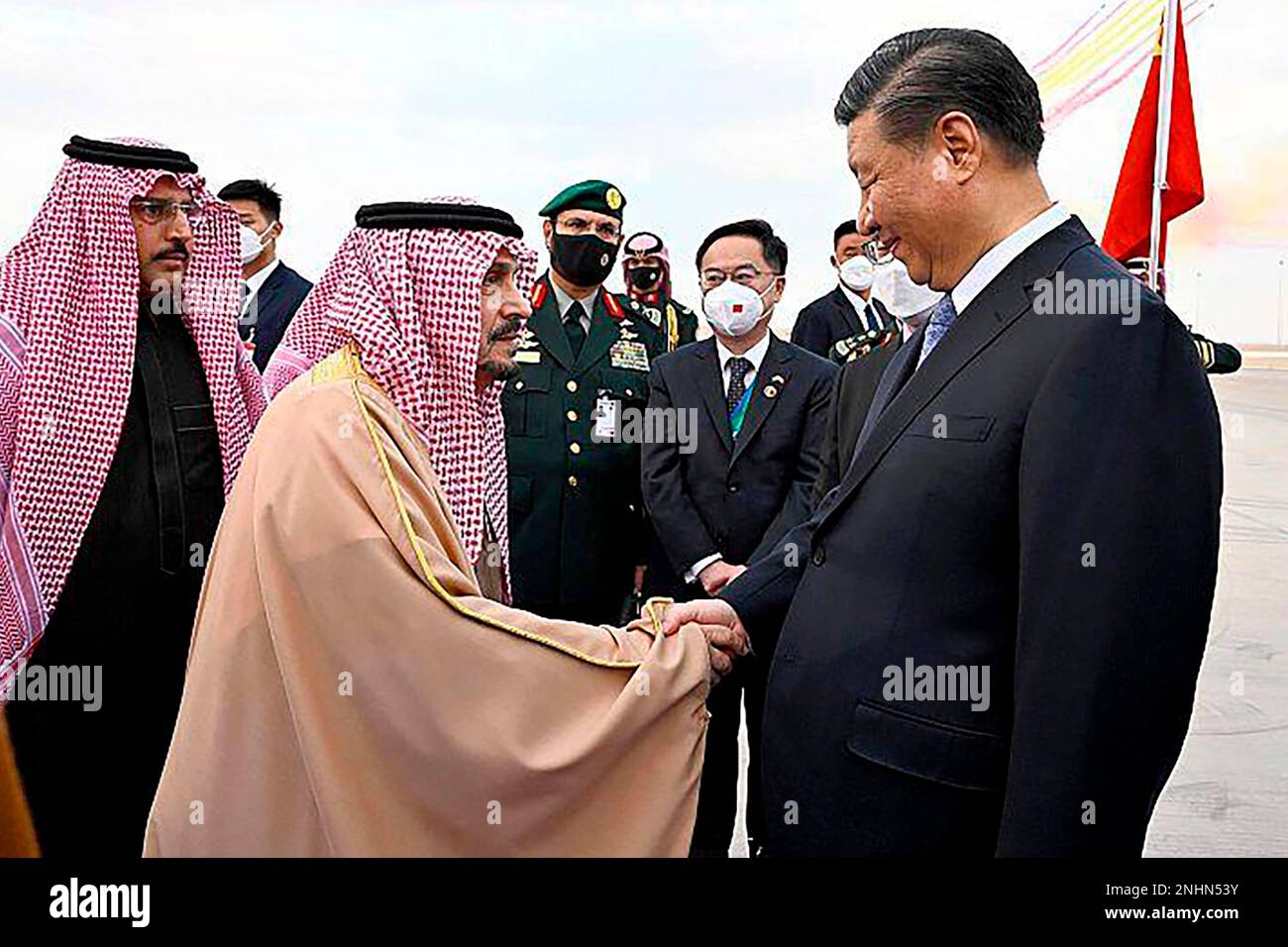 Chinese President Xi Jinping, right, shakes hands with Prince Faisal ...