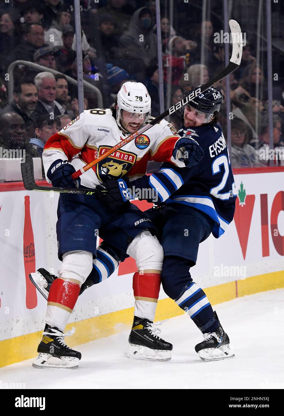 Winnipeg Jets' Michael Eyssimont (23) checks Florida Panthers' Josh ...