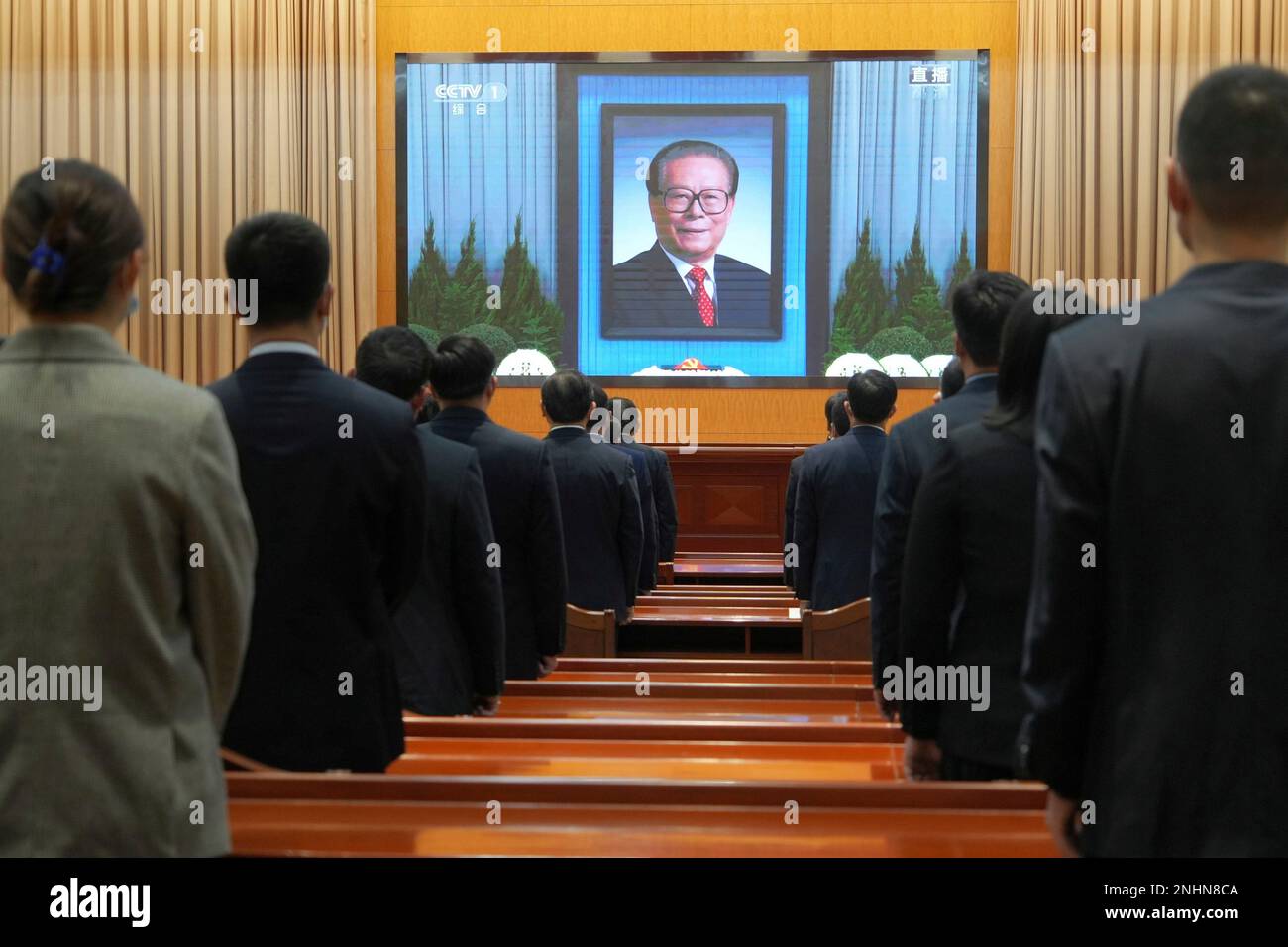 Cadres watch the televised mourning service to the late former Chinese ...