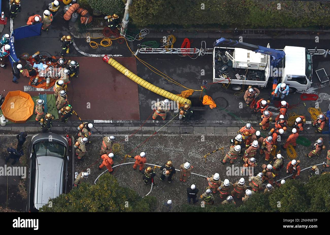 An aerial photo shows firefighters conducting a rescue at a site that ...