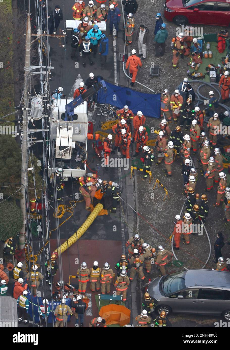 An aerial photo shows firefighters conducting a rescue at a site that ...