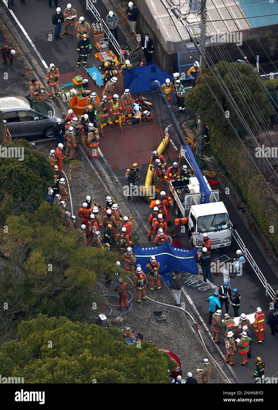 An aerial photo shows firefighters conducting a rescue at a site that ...