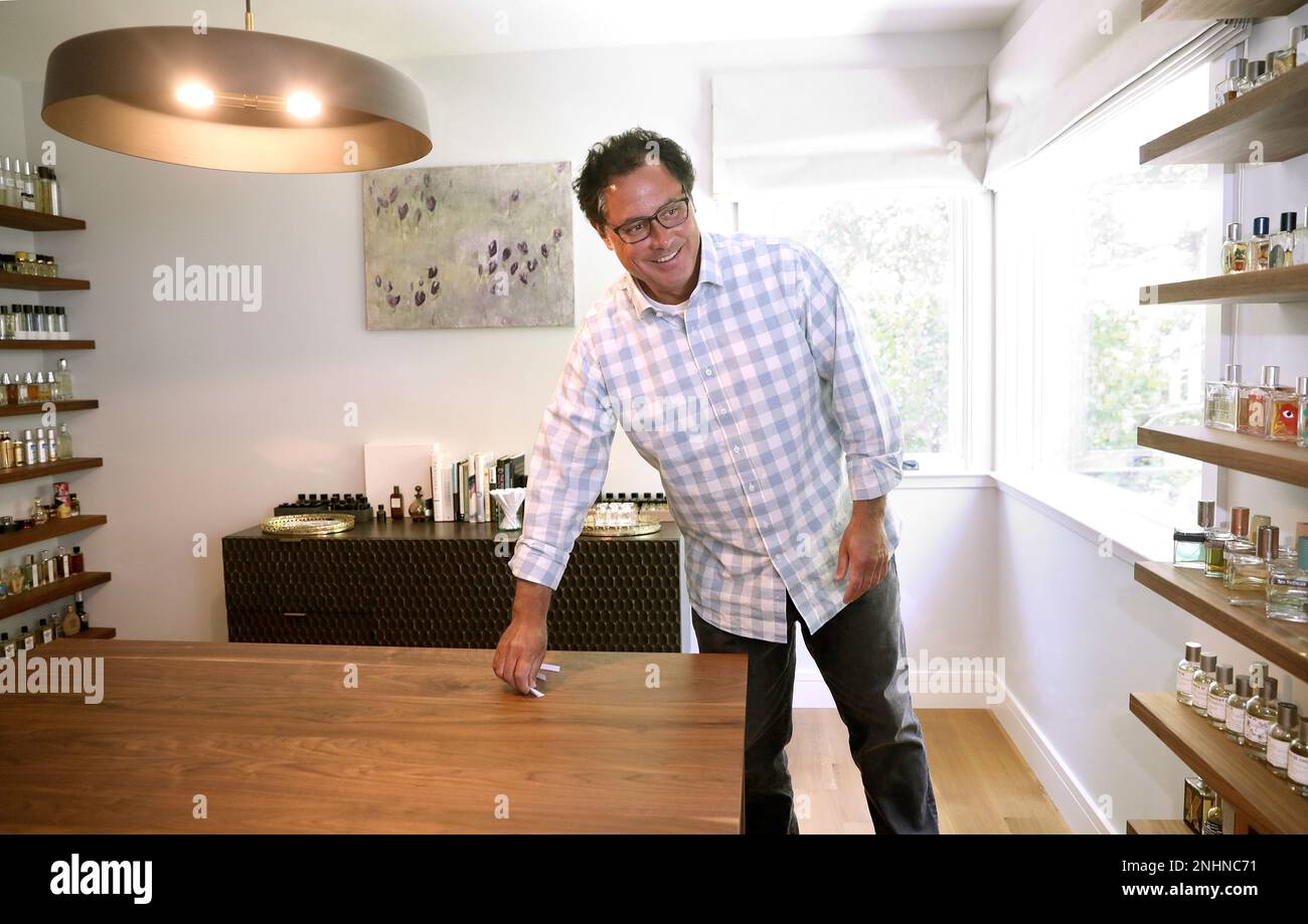 Dan Rolleri shows his perfumery as he sprays a swatch to sample a ...