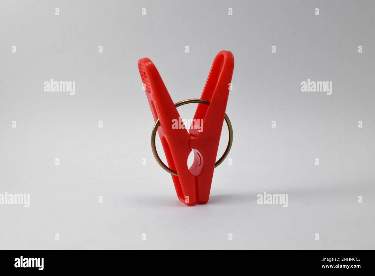 Red plastic clothespin isolated on white background. Plastic clips ...