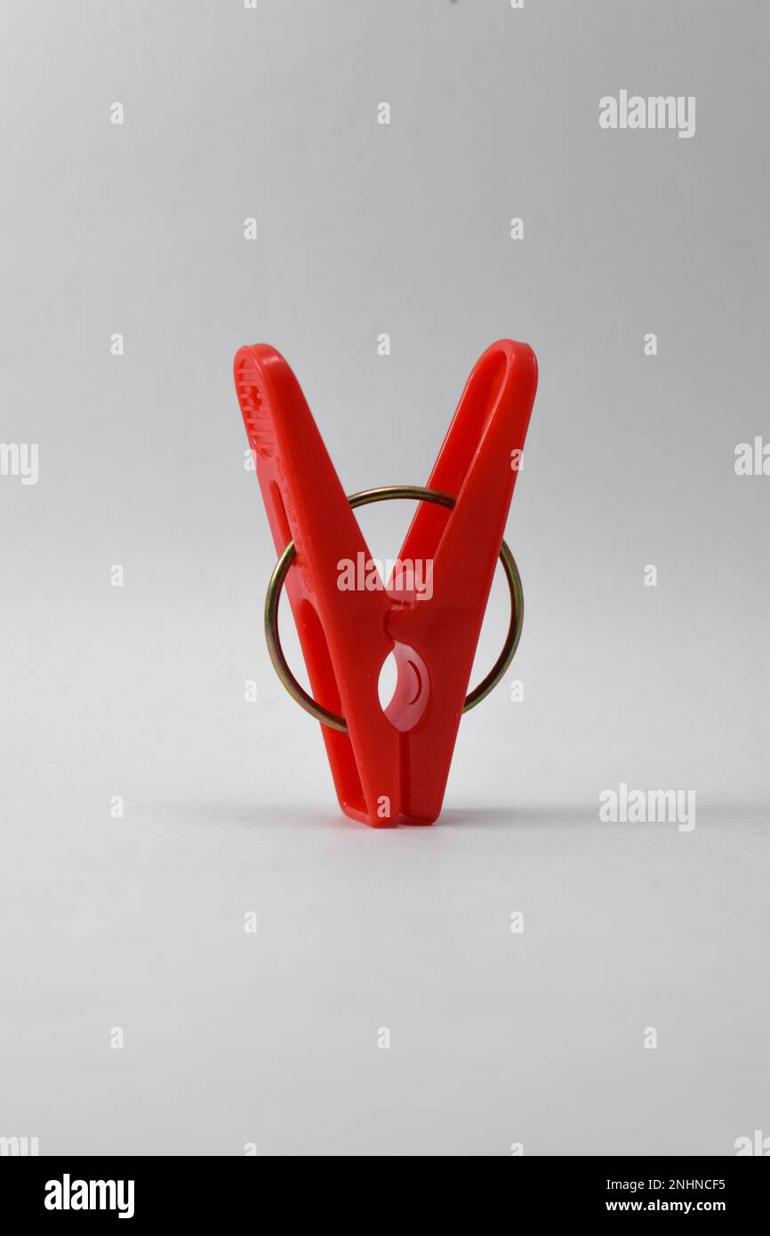 Red plastic clothespin isolated on white background. Plastic clips ...
