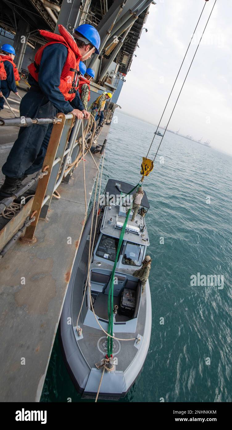 PORT OF DJIBOUTI, Djibouti- A MSRON-1A patrol boat is being prepared to ...