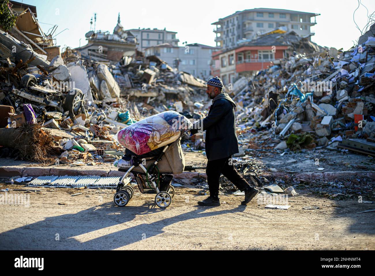 Hatay, Turkey. 14th Feb, 2023. An earthquake survivor returns to his ...