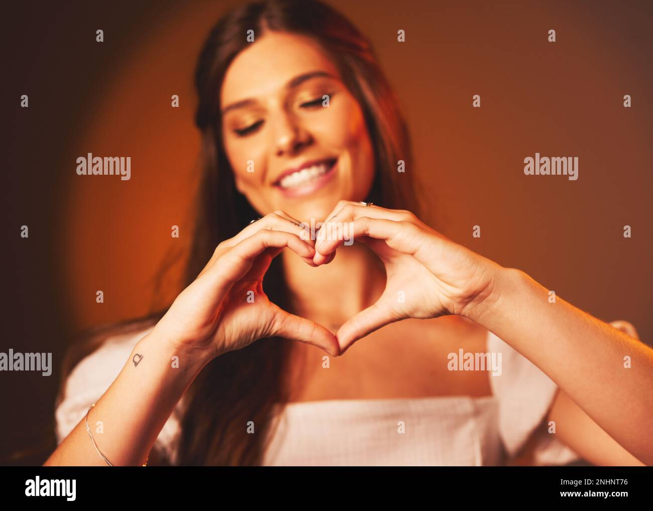 Woman, hand heart sign and love symbol of a happy female person in ...