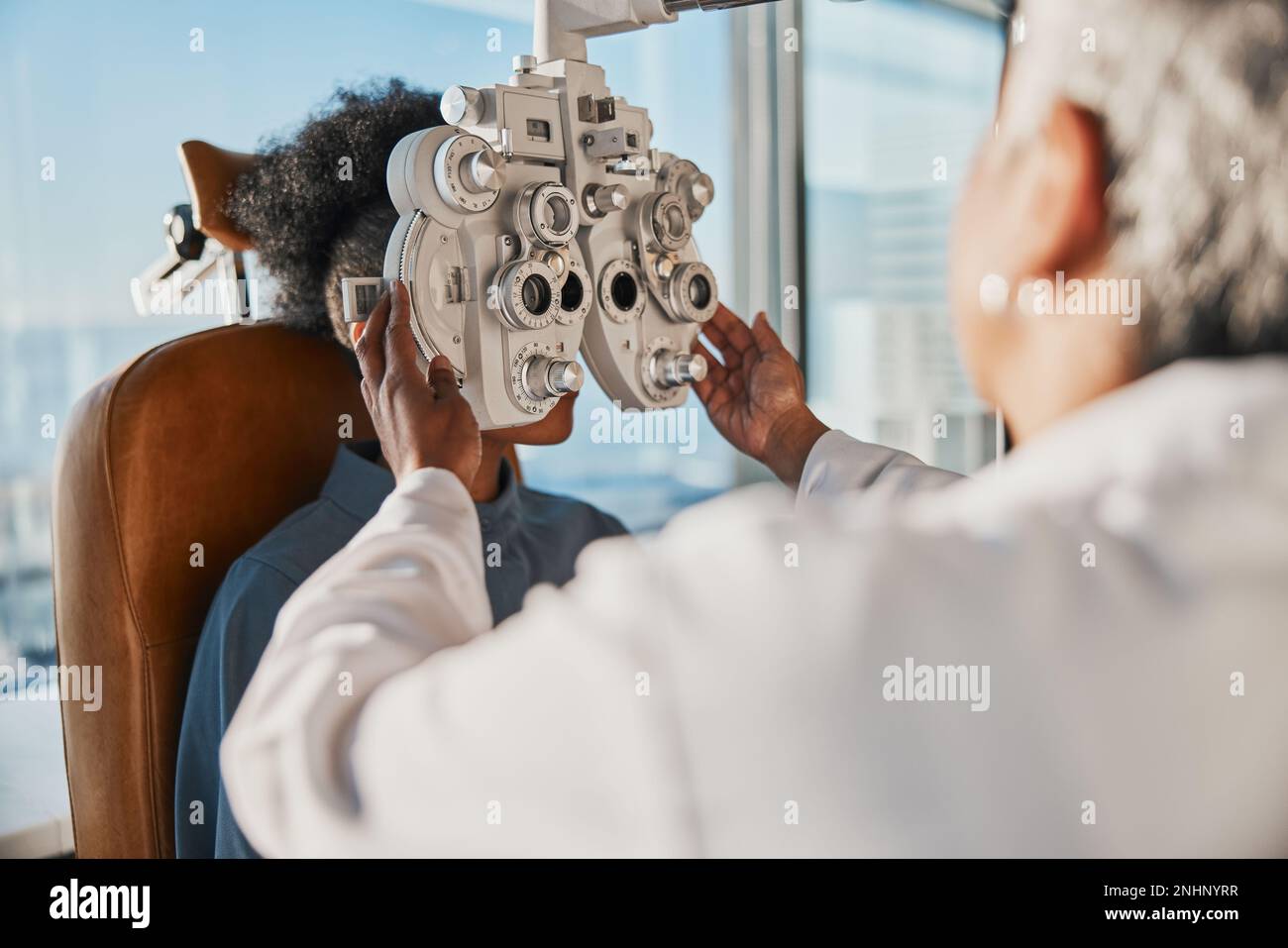 Optometry, healthcare and optometrist doing a eye test for a patient ...