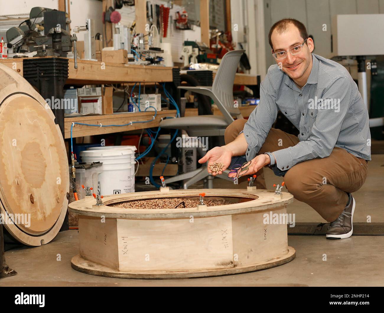 Founder and CEO Eric Varady shows the barrel tumbler he made to barrel ...