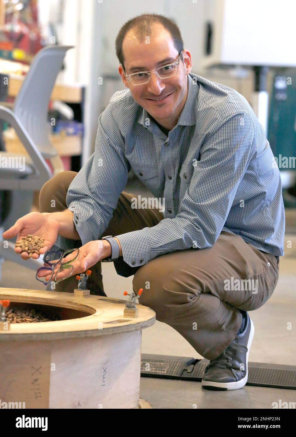 Founder and CEO Eric Varady shows the barrel tumbler he made to barrel ...