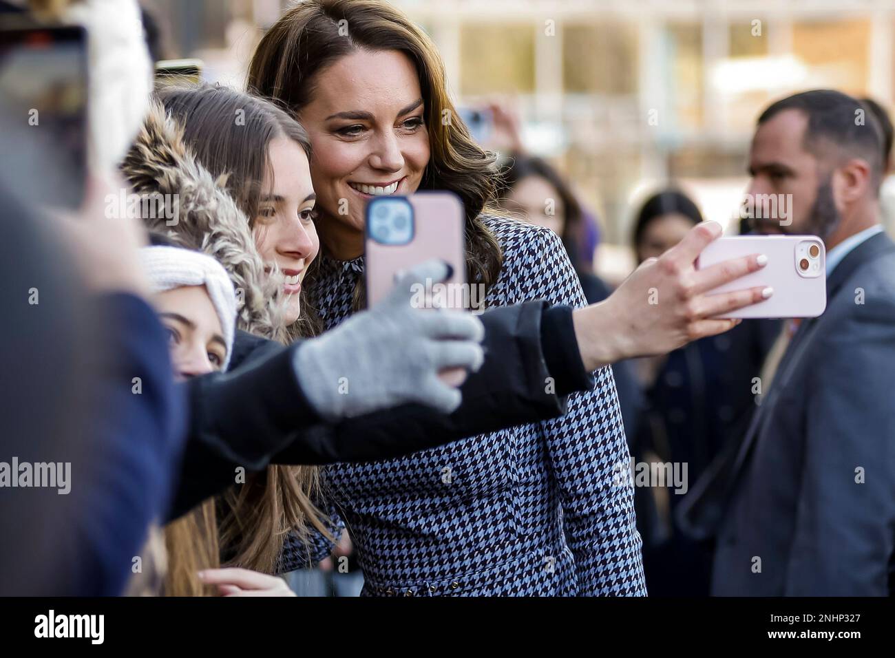 Kate, Princess of Wales, poses for a selfie with a well-wisher gathered ...