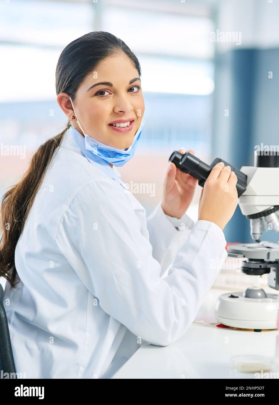 You see something new each time. Portrait of a young scientist using a ...
