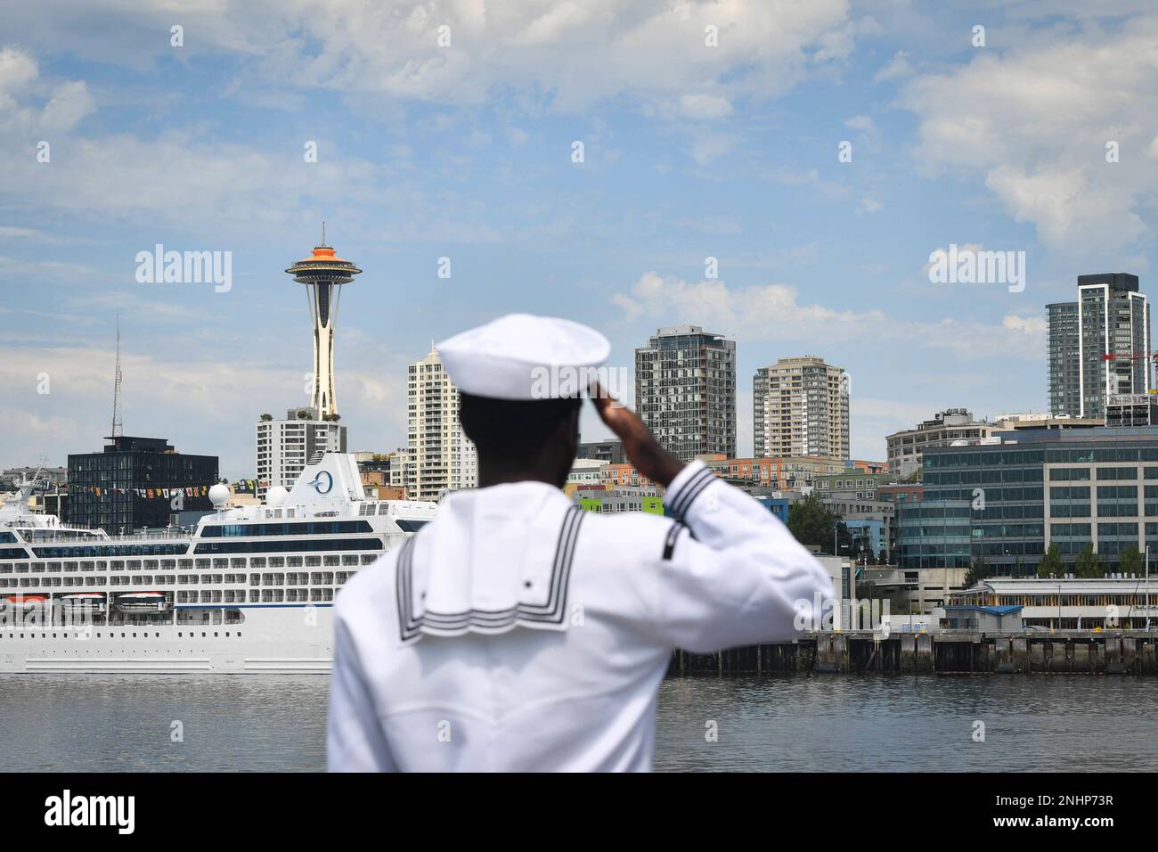 A Sailor renders “passing honors” aboard the Ticonderoga-class guided ...