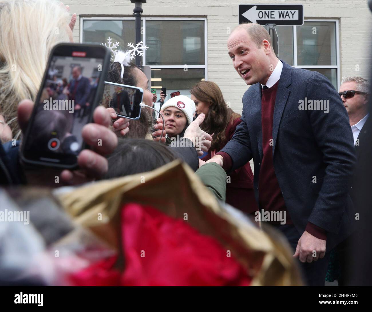 Britain's Prince William greets people in the crowd after a visit to ...